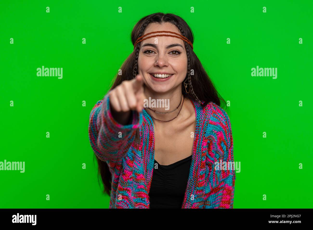 Amused hippie woman pointing finger to camera, laughing out loud ...