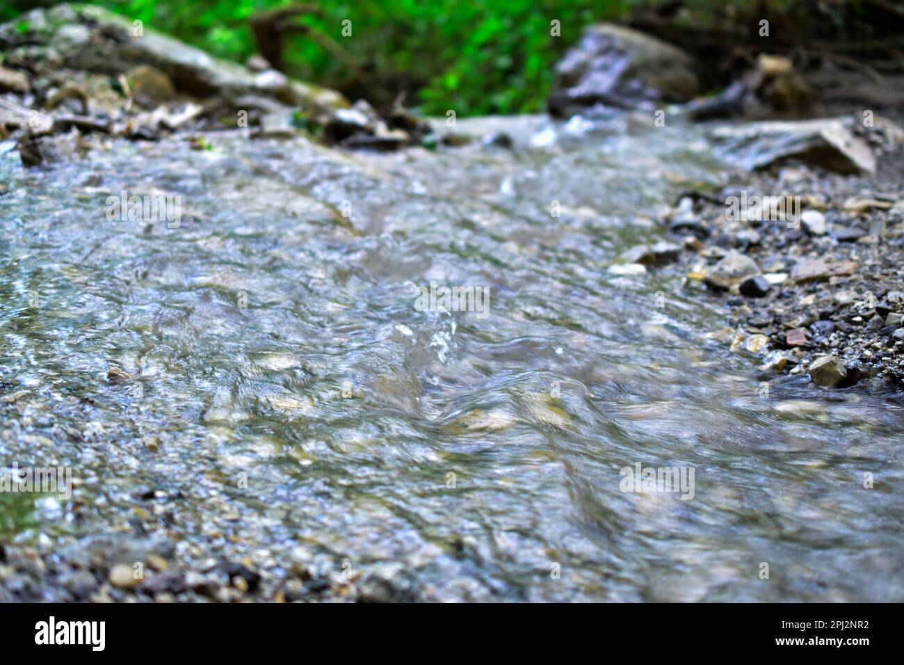 Closeup of clean water flowing Stock Photo - Alamy