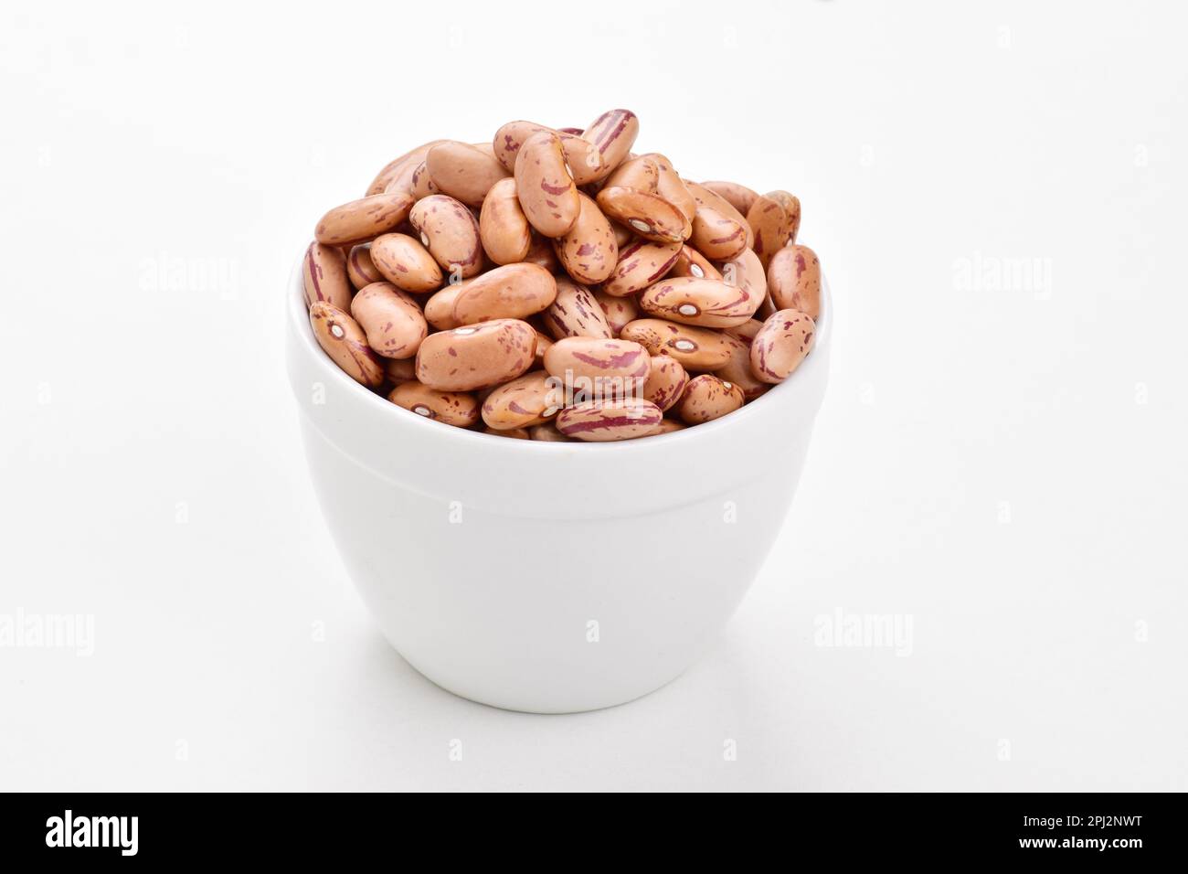Raw kindey beans in bowl on white background Stock Photo - Alamy