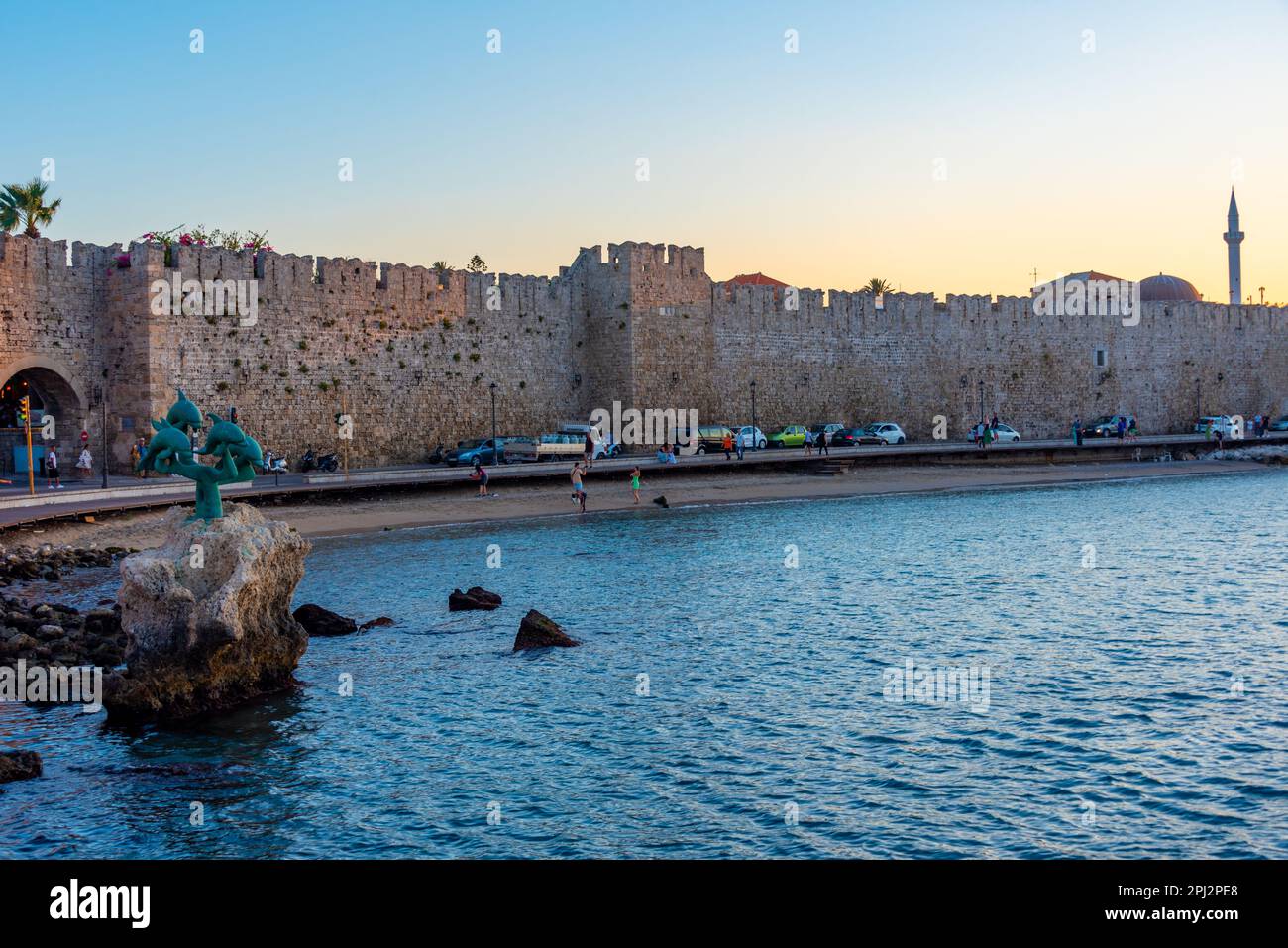 Rhodes, Greece, August 27, 2022: Sunset view of a dolphin statue in ...