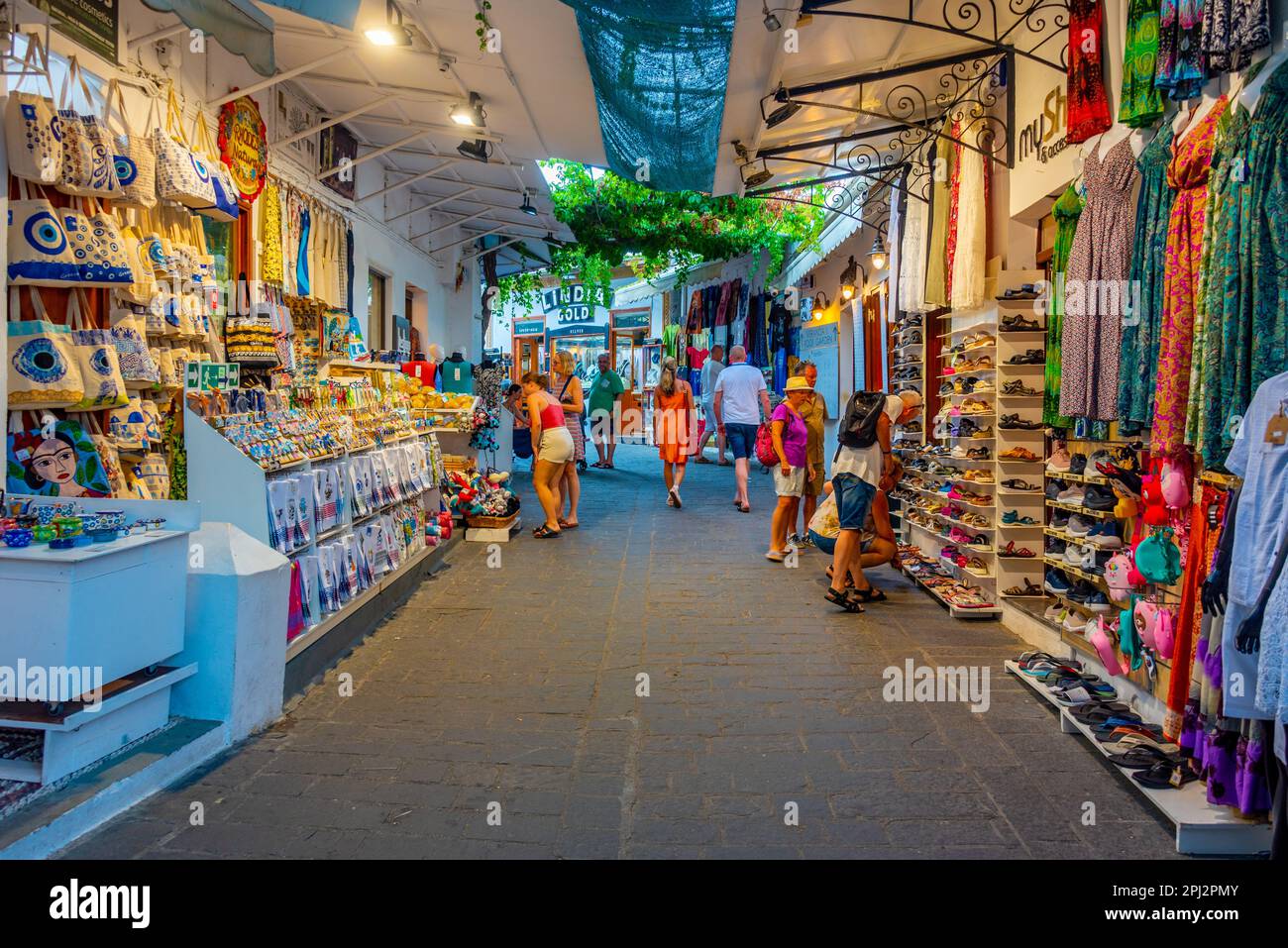 Lindos, Greece, August 31, 2022: Tourist street of Greek town Lindos at ...