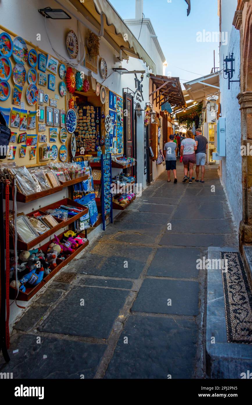Lindos, Greece, August 31, 2022: Tourist street of Greek town Lindos at ...