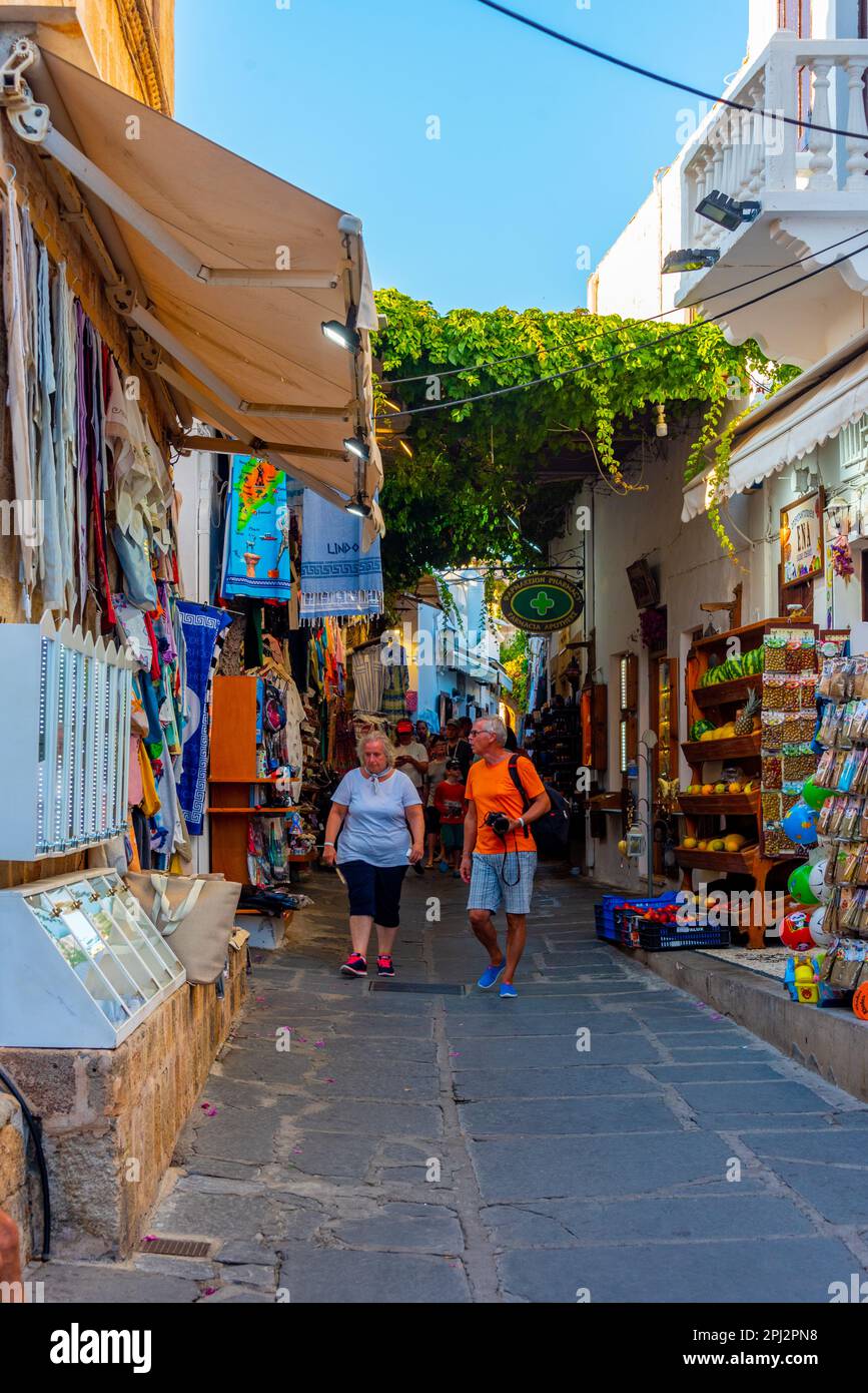 Lindos, Greece, August 31, 2022: Tourist street of Greek town Lindos at ...
