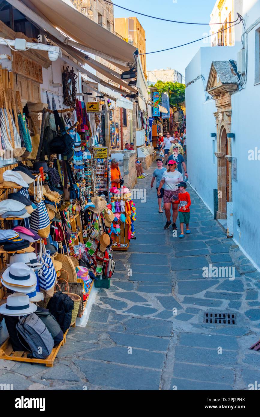 Lindos, Greece, August 31, 2022: Tourist street of Greek town Lindos at ...
