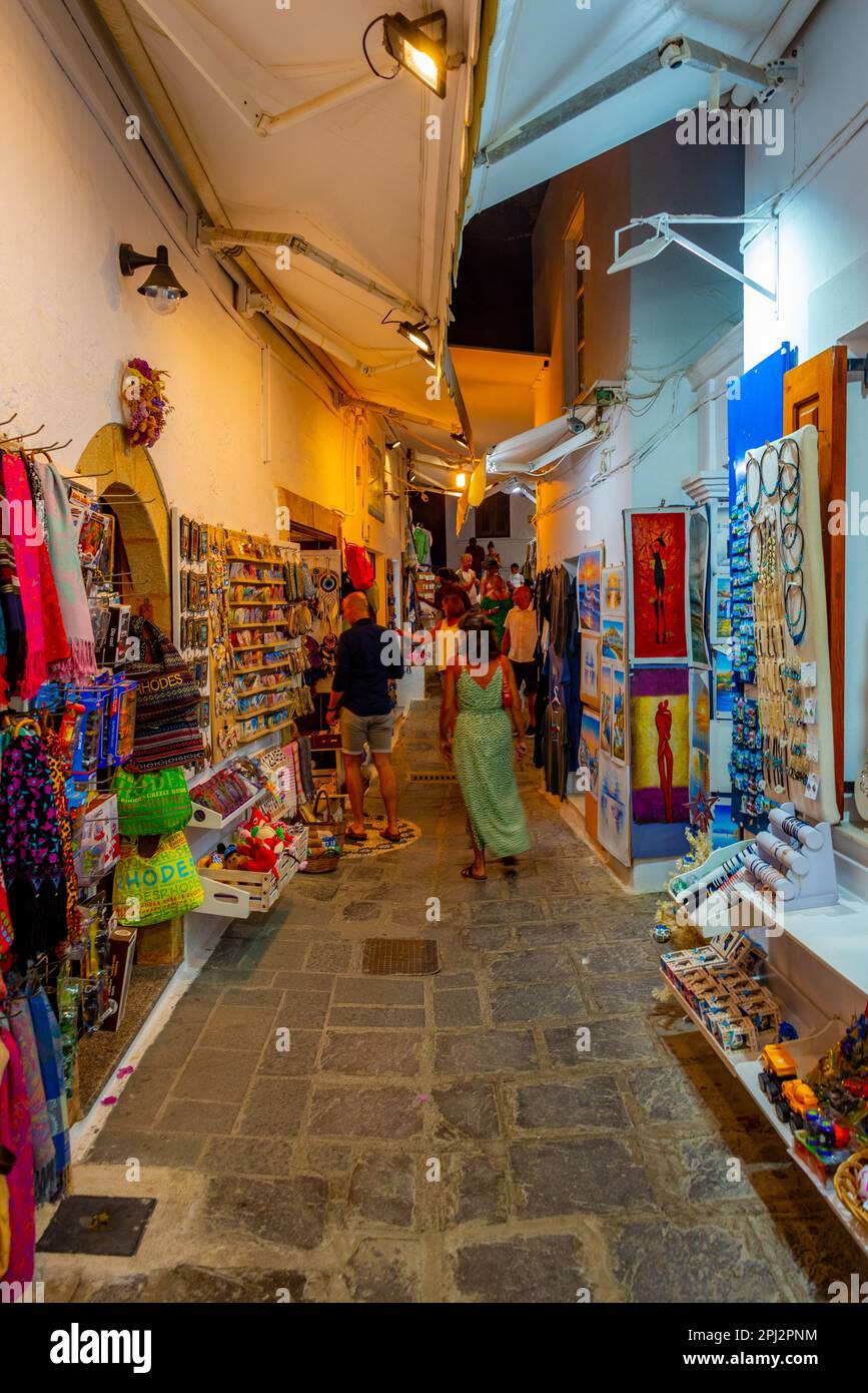 Lindos, Greece, August 31, 2022: Tourist street of Greek town Lindos at ...