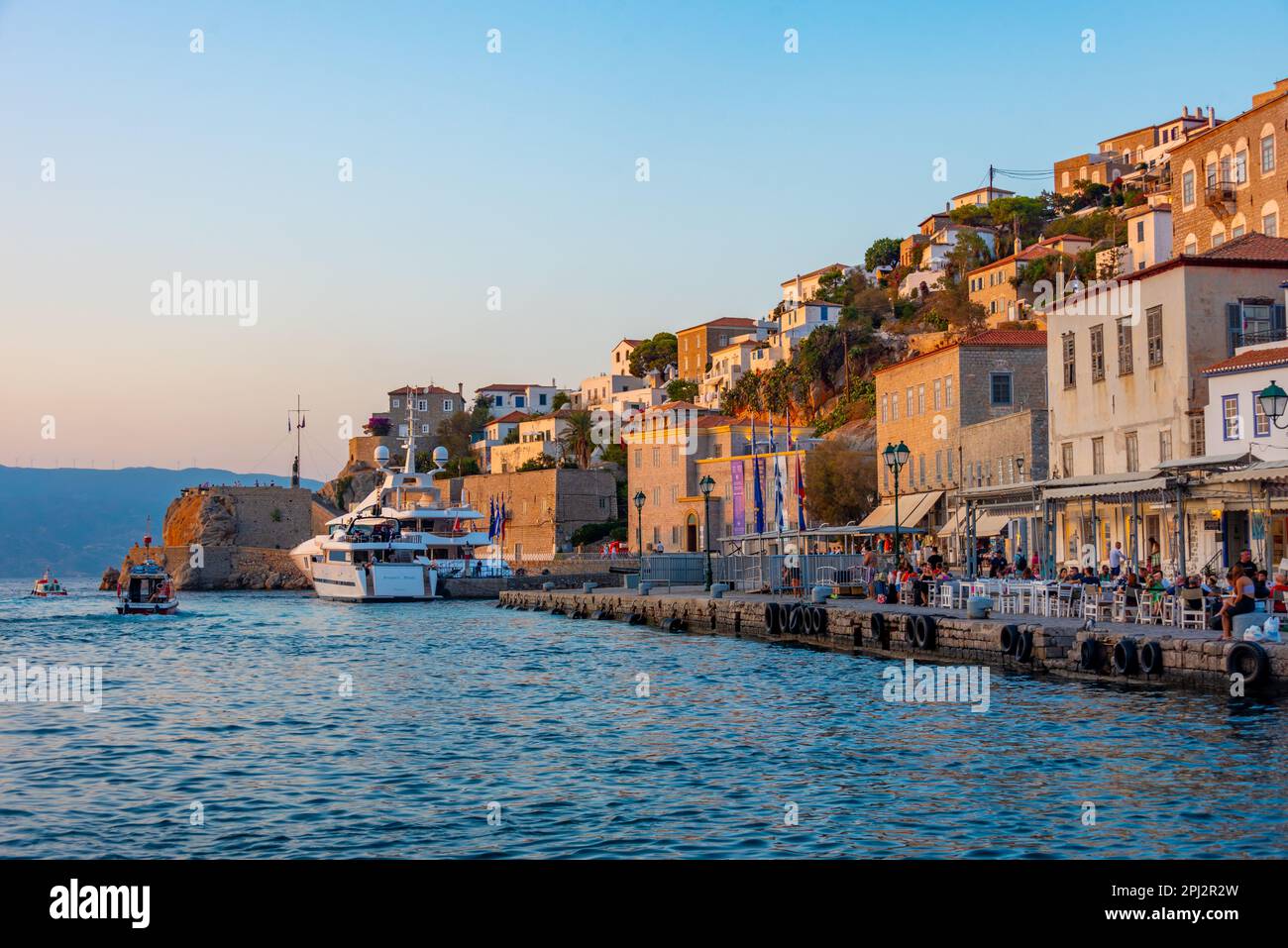 Hydra, Greece, September 4, 2022: Sunset view of a seaside promenade at ...