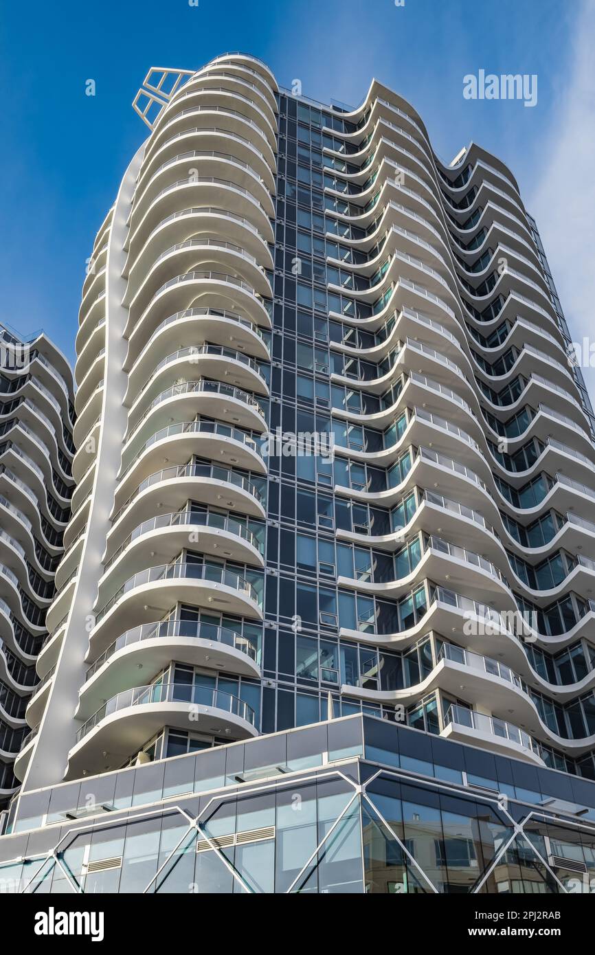 A highrise building against the blue sky. Condominium or apartment ...