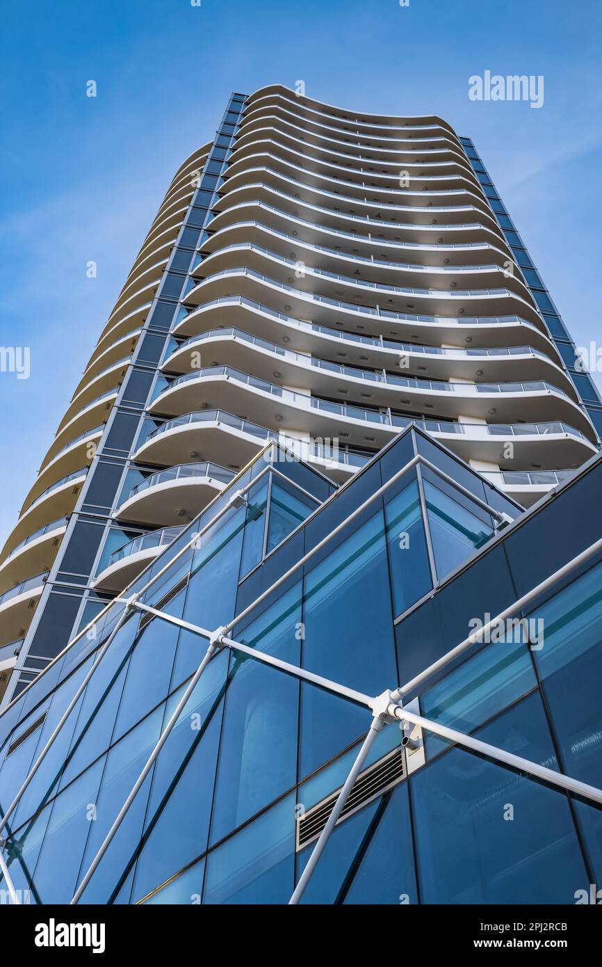 A highrise building against the blue sky. Condominium or apartment ...