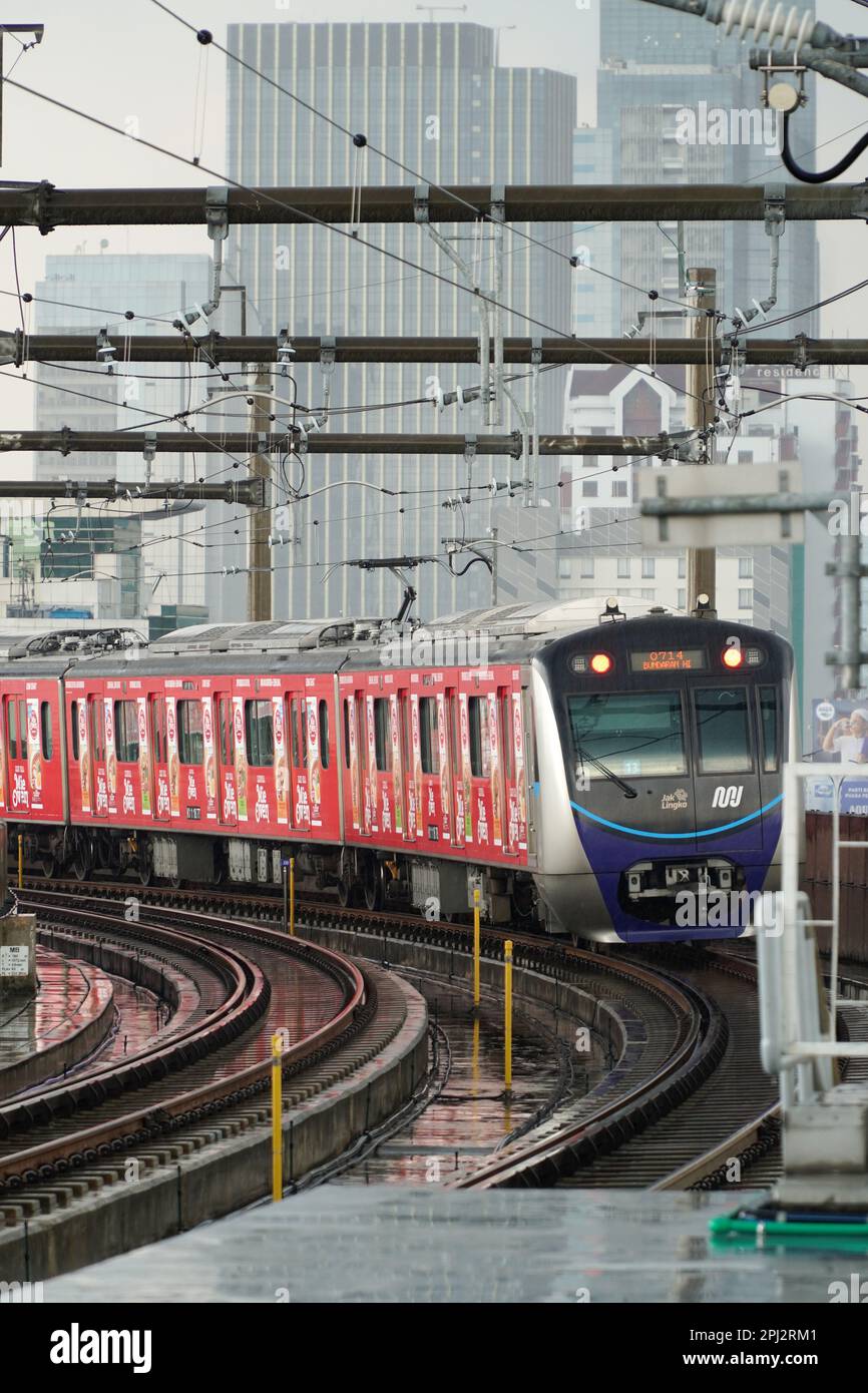 Mass Rapid Transit (MRT) train in passing Fatmawati Station with ...