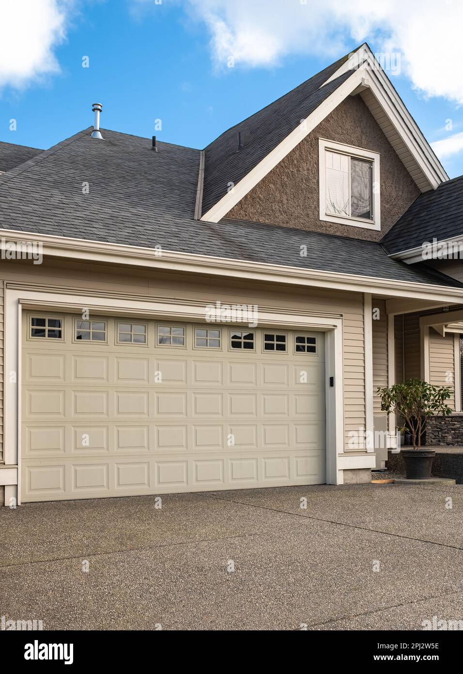 Garage Door. Modern house with garage door that is closed. A perfect ...