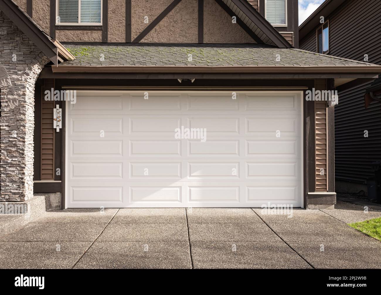 Garage Door. Modern house with garage door that is closed. A perfect ...