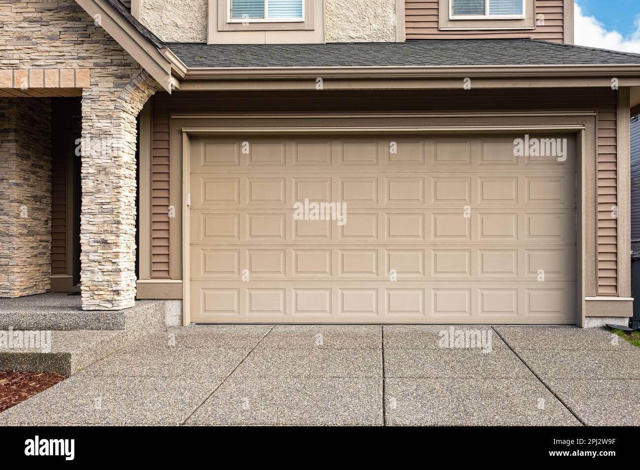 Garage Door. Modern house with garage door that is closed. A perfect ...