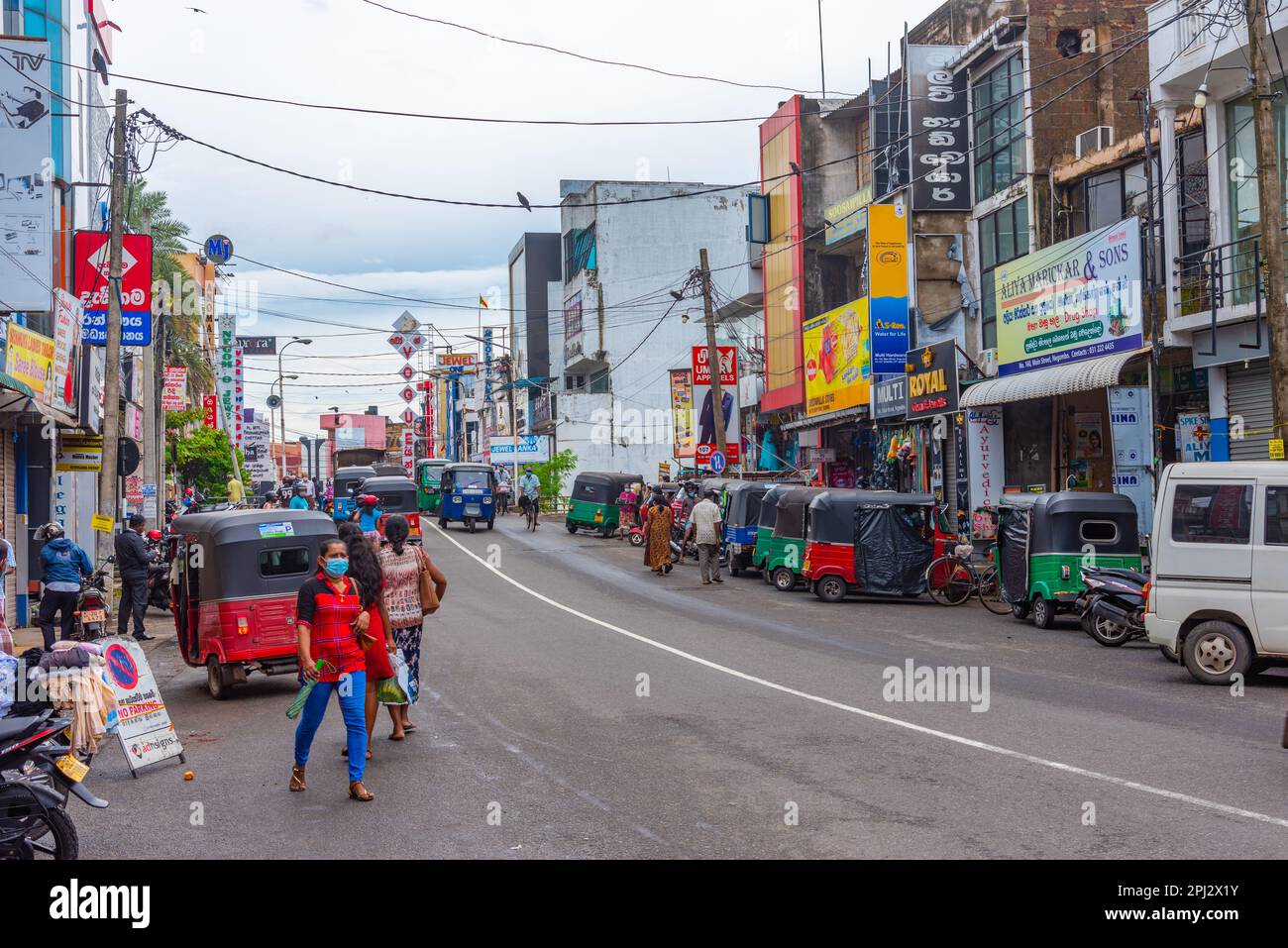 Negombo, Sri Lanka, February 13, 2022: Colorful houses on a street in ...
