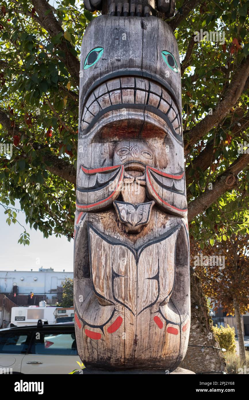 Detail of totem pole at tourist travel attraction in Duncan city. An ...