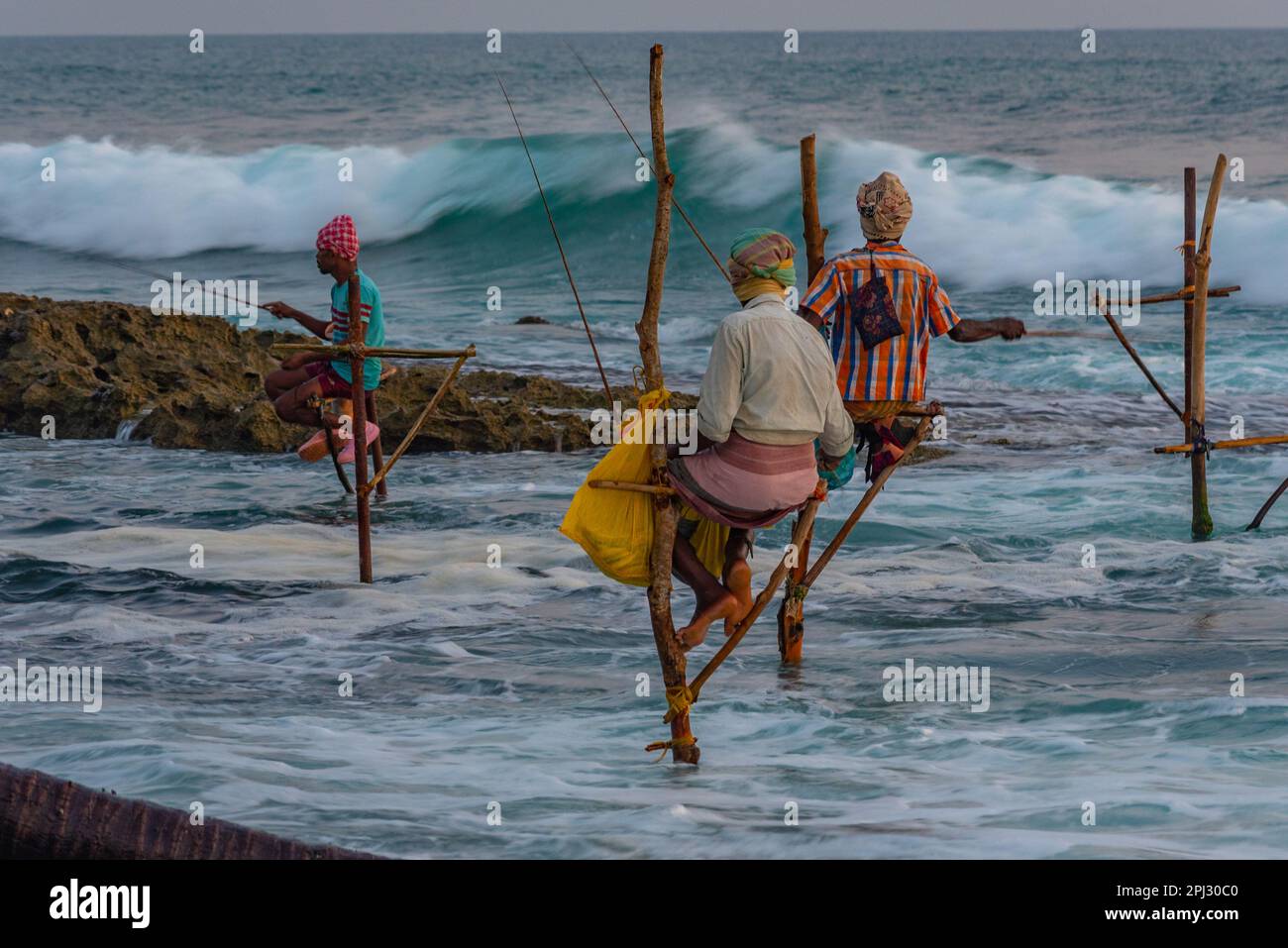 Koggala, Sri Lanka, January 21, 2022: Sunset view of traditional stilt ...