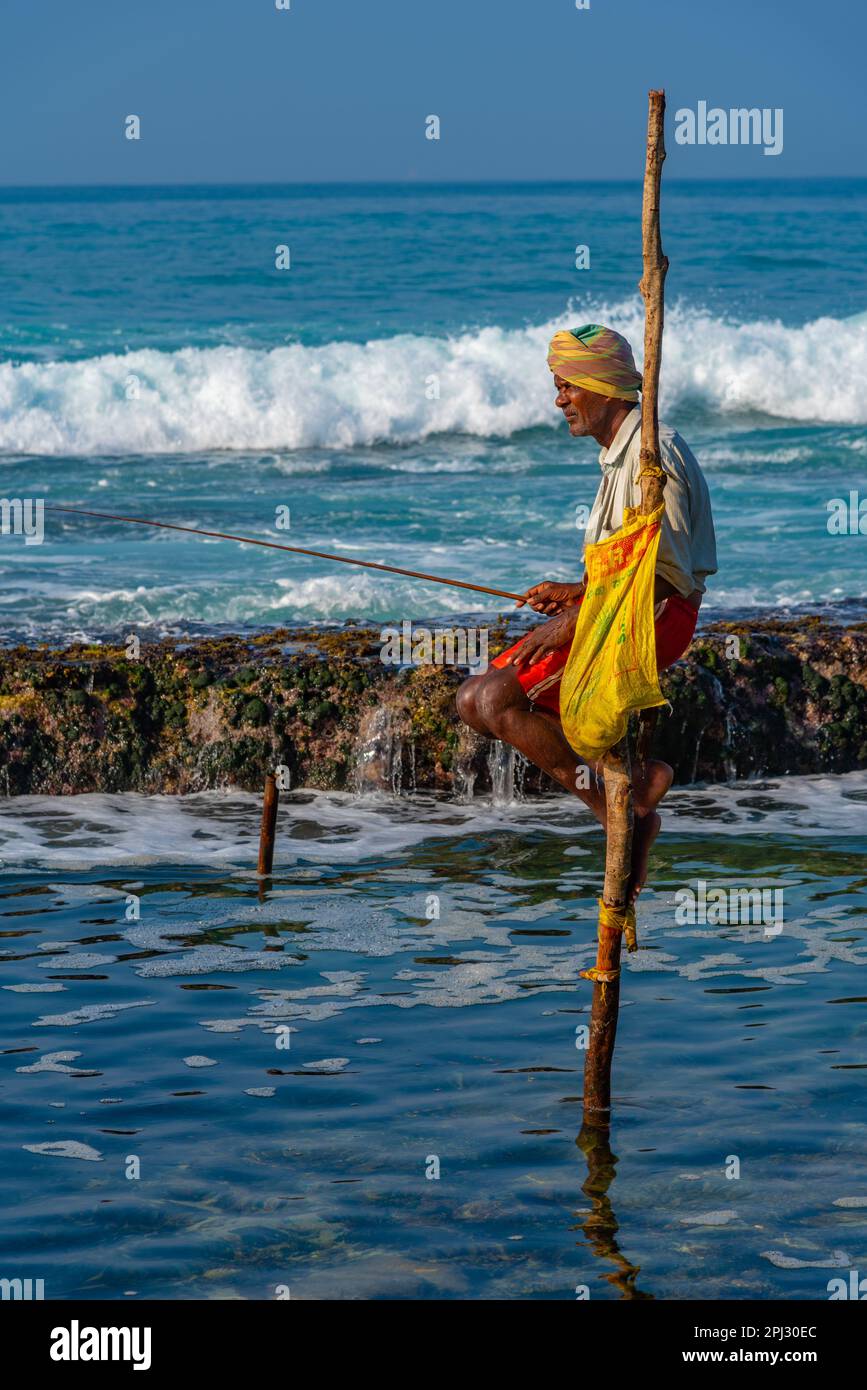 Koggala, Sri Lanka, January 21, 2022: Sunset view of traditional stilt ...