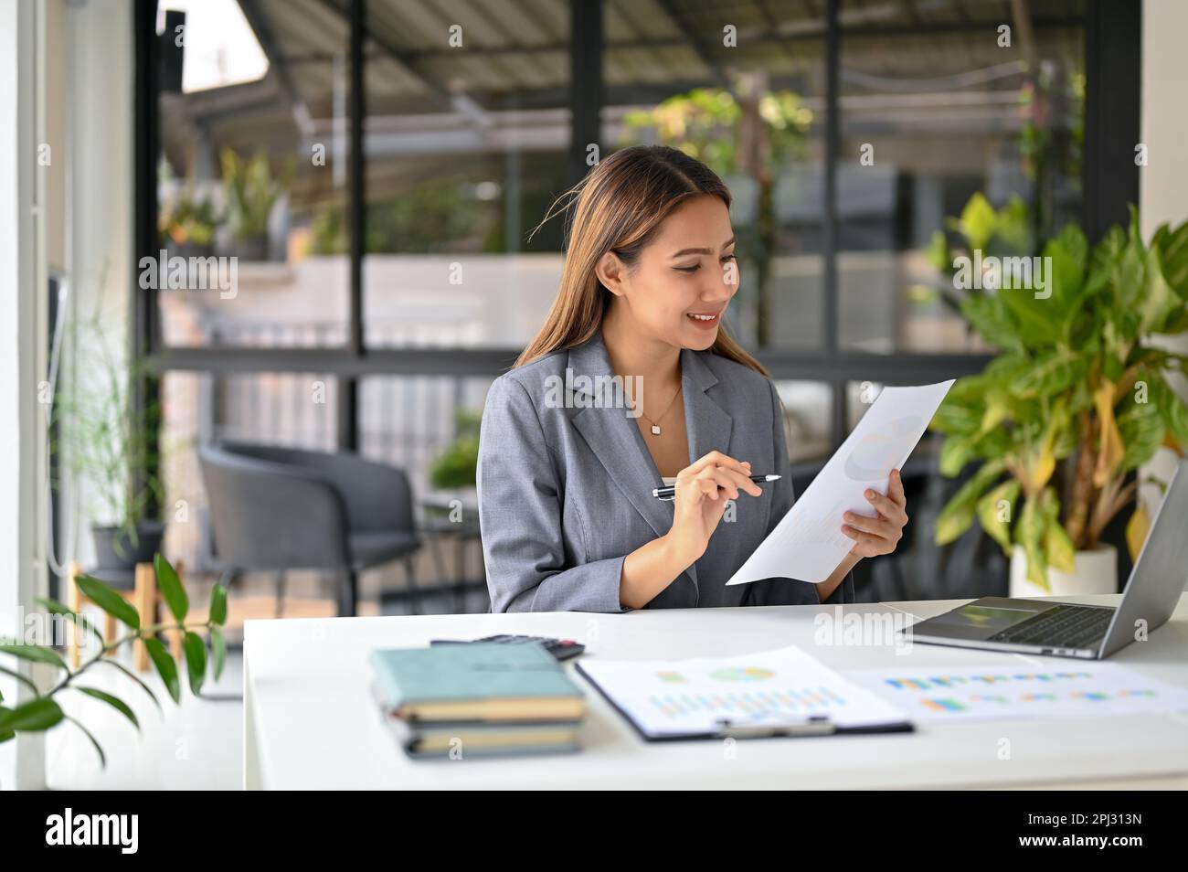 Focused and professional millennial Asian businesswoman or female ...