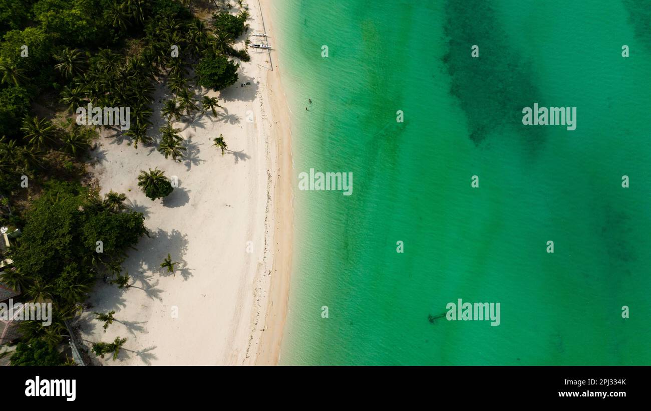 Sandy beach and blue sea in a tropical resort. Bantayan island ...