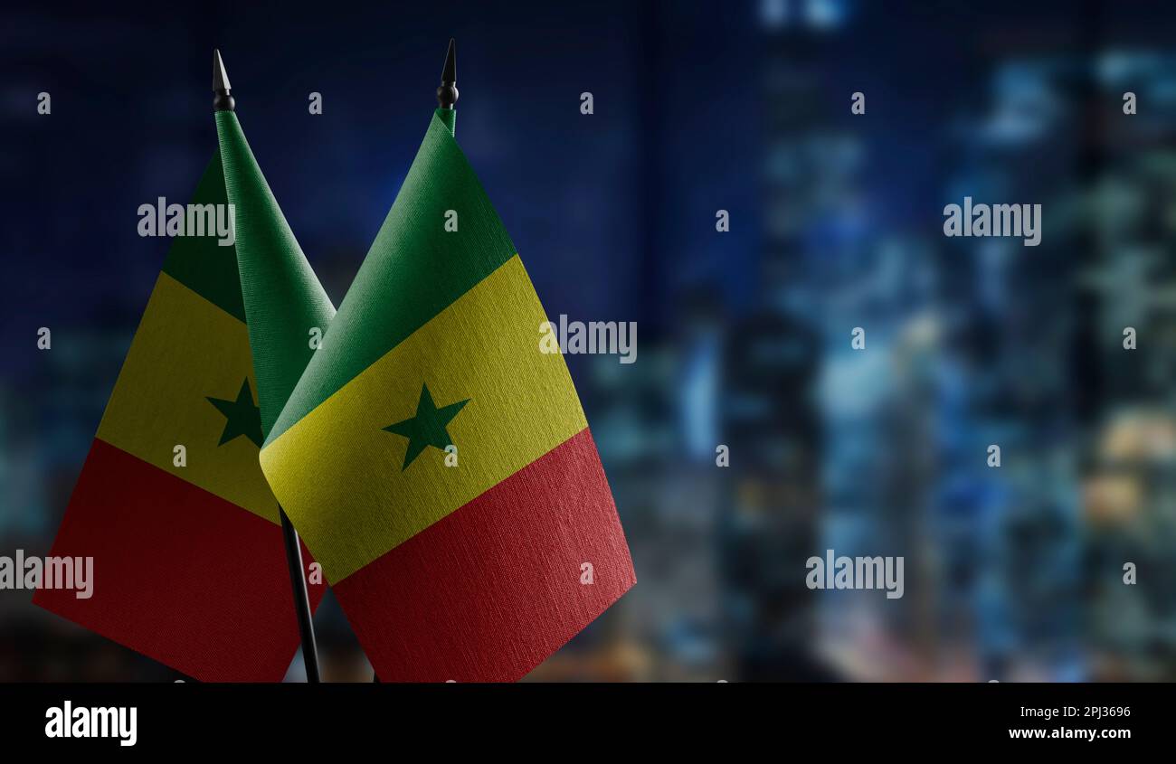 Small flags of the Senegal on an abstract blurry background Stock Photo ...