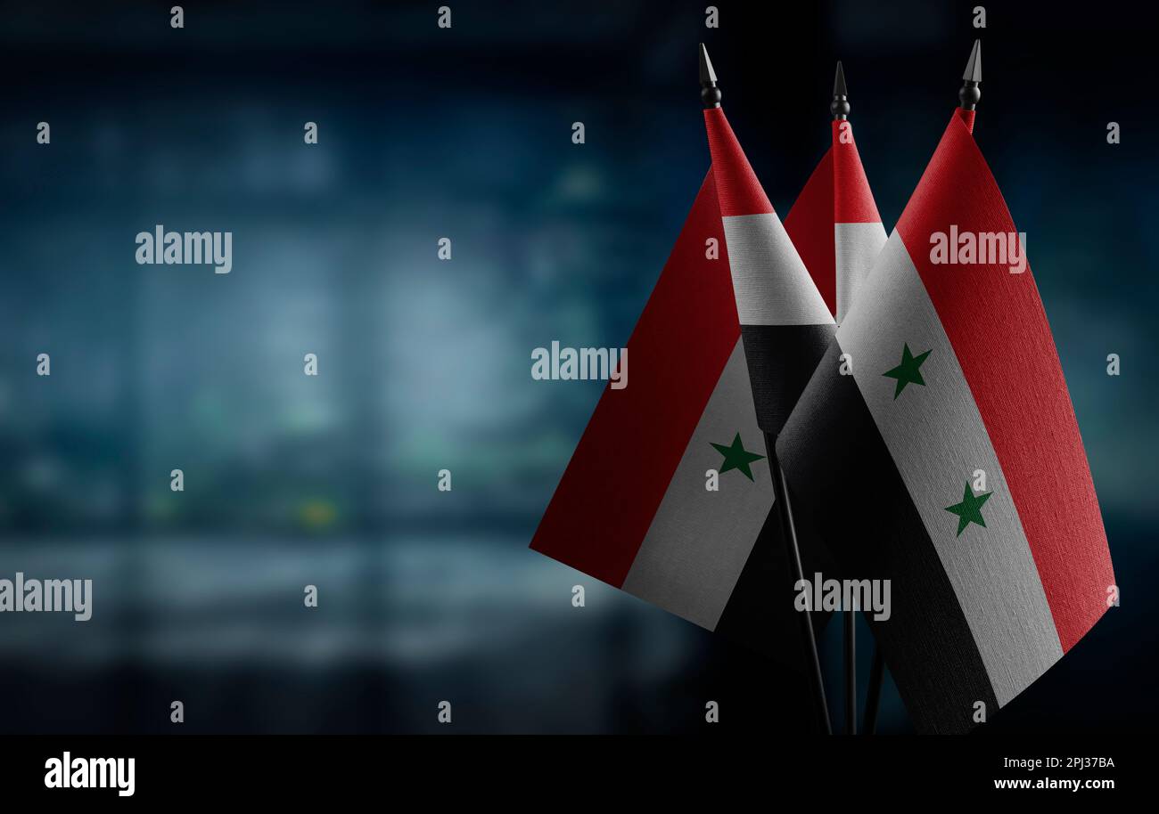 Small flags of the Syria on an abstract blurry background Stock Photo ...