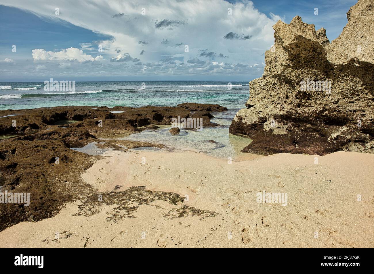 The Suluban beach in Bali, Indonesia, with rough rocks on the right ...