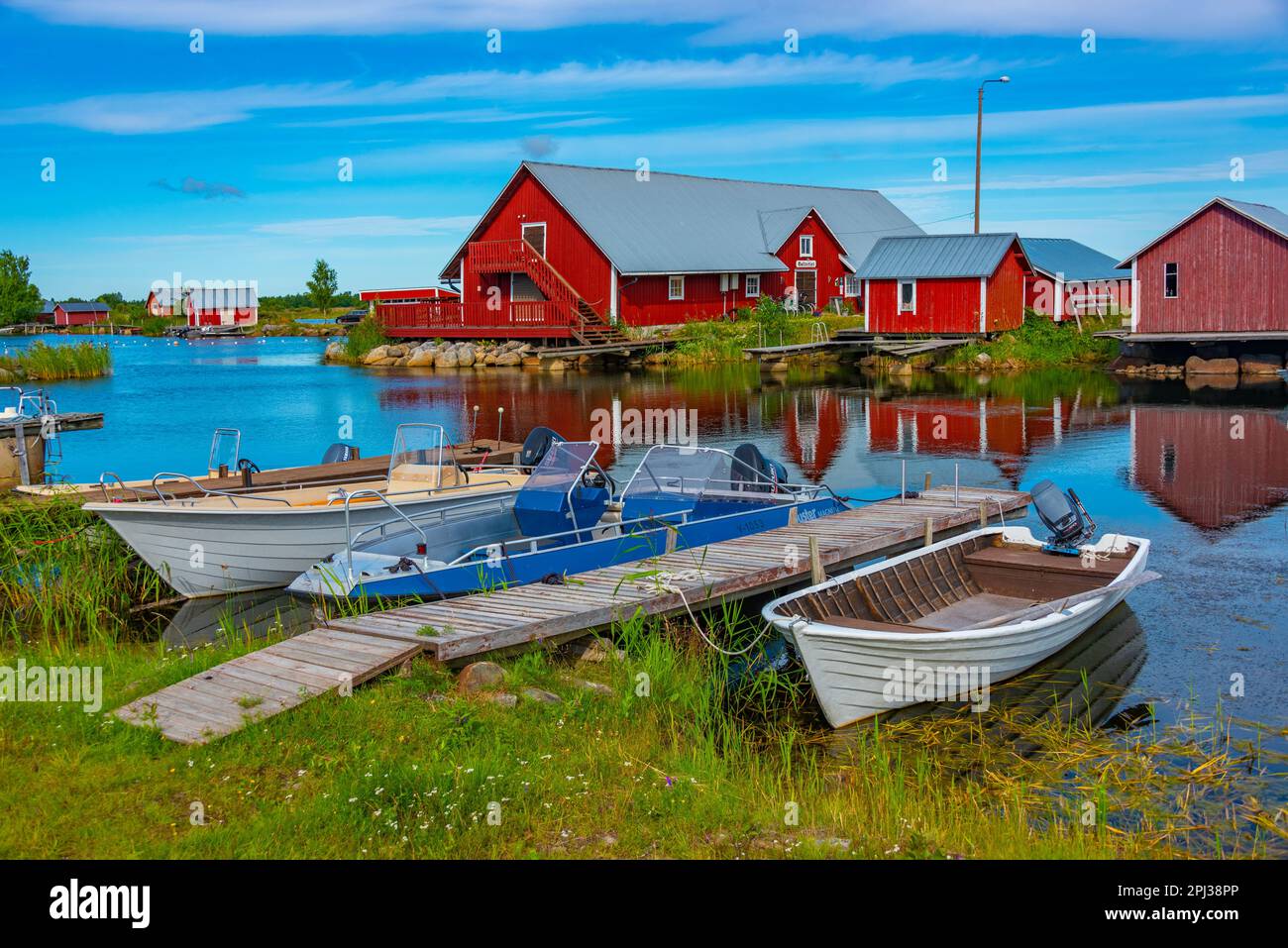 Svedjehamn, Finland, July 24, 2022: Red timber boat houses at ...