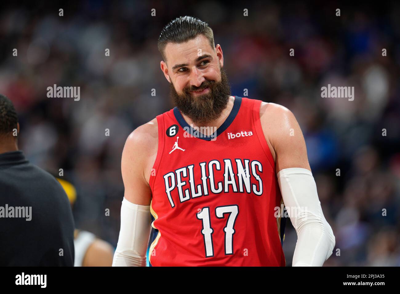New Orleans Pelicans center Jonas Valanciunas smiles as he heads to the ...
