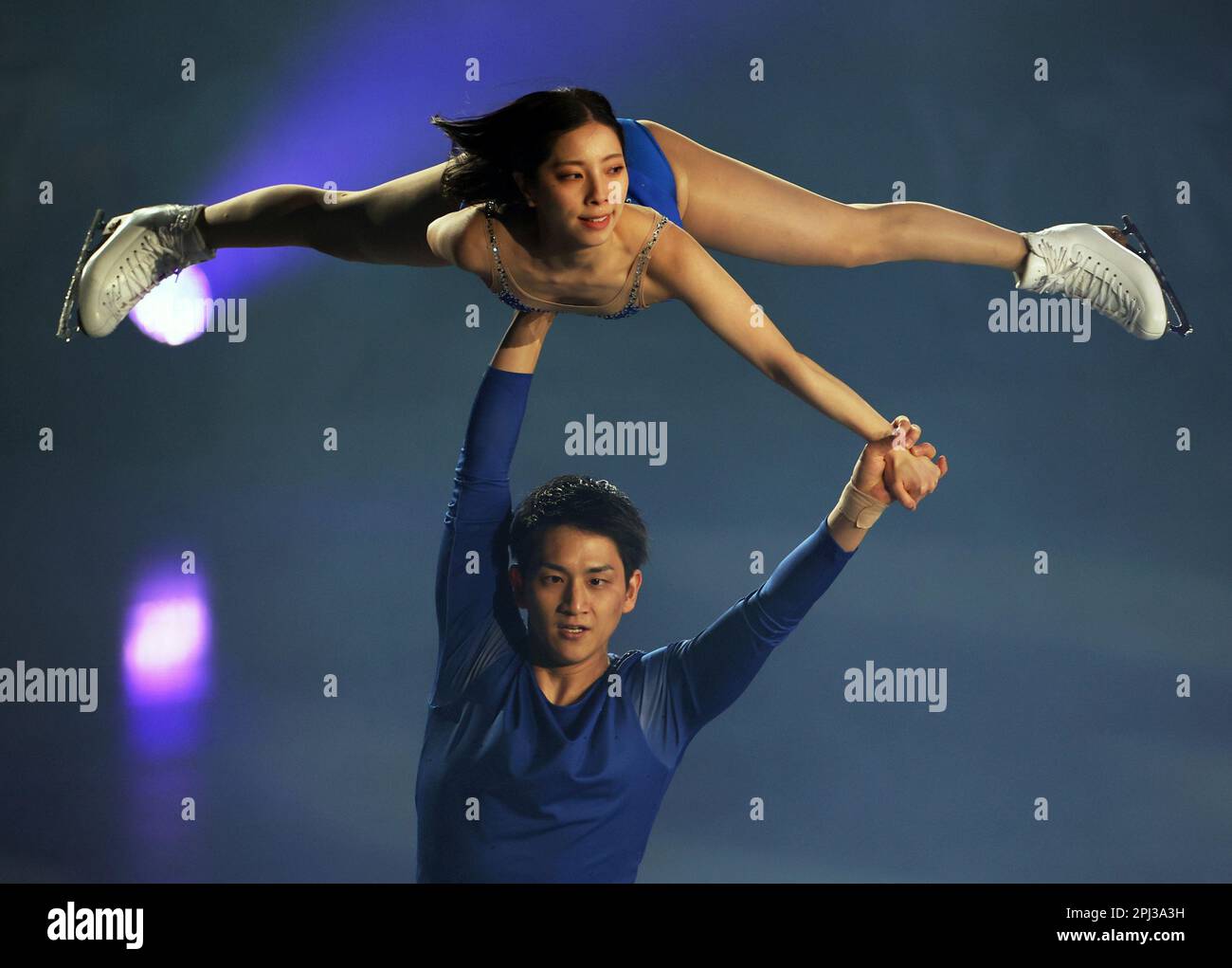 Japanese figure skaters Riku Miura and Ryuichi Kihara perform during an ...