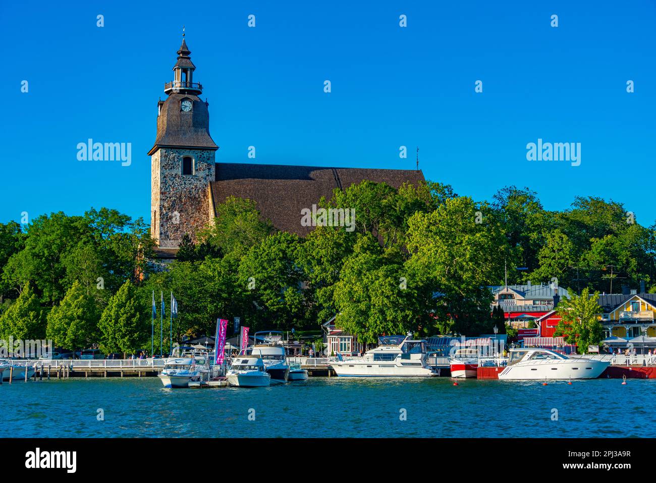 Naantali, Finland, July 29, 2022: Naantali church viewed over marina in ...