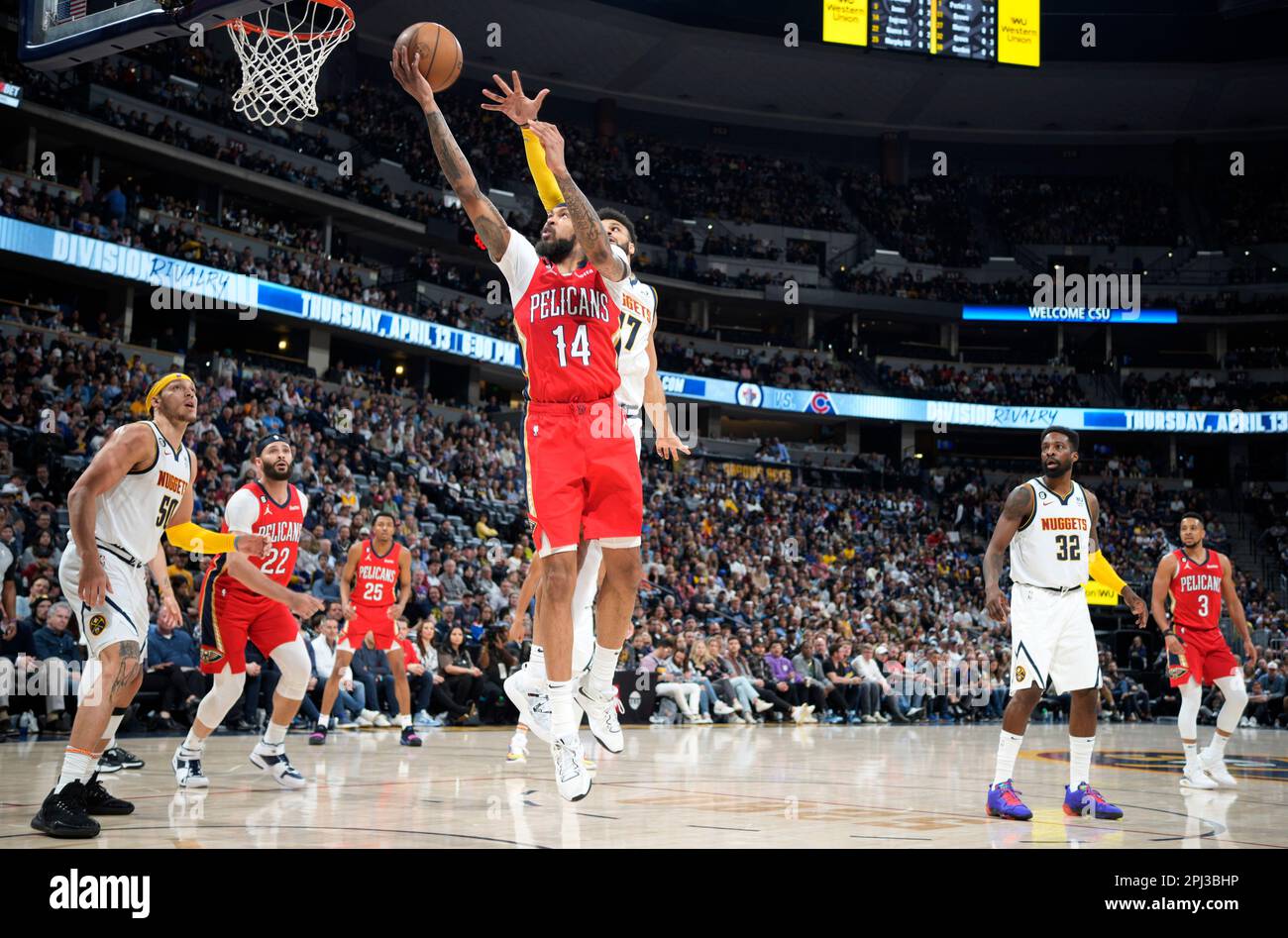 New Orleans Pelicans forward Brandon Ingram (14) shoots next to Denver ...