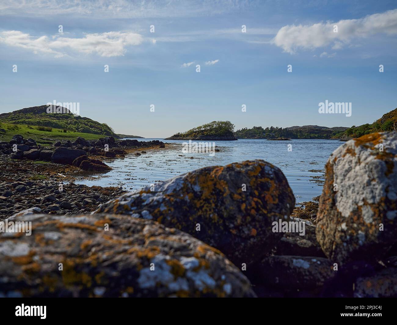 landscape of the northern highlands in Scotland along a small river ...