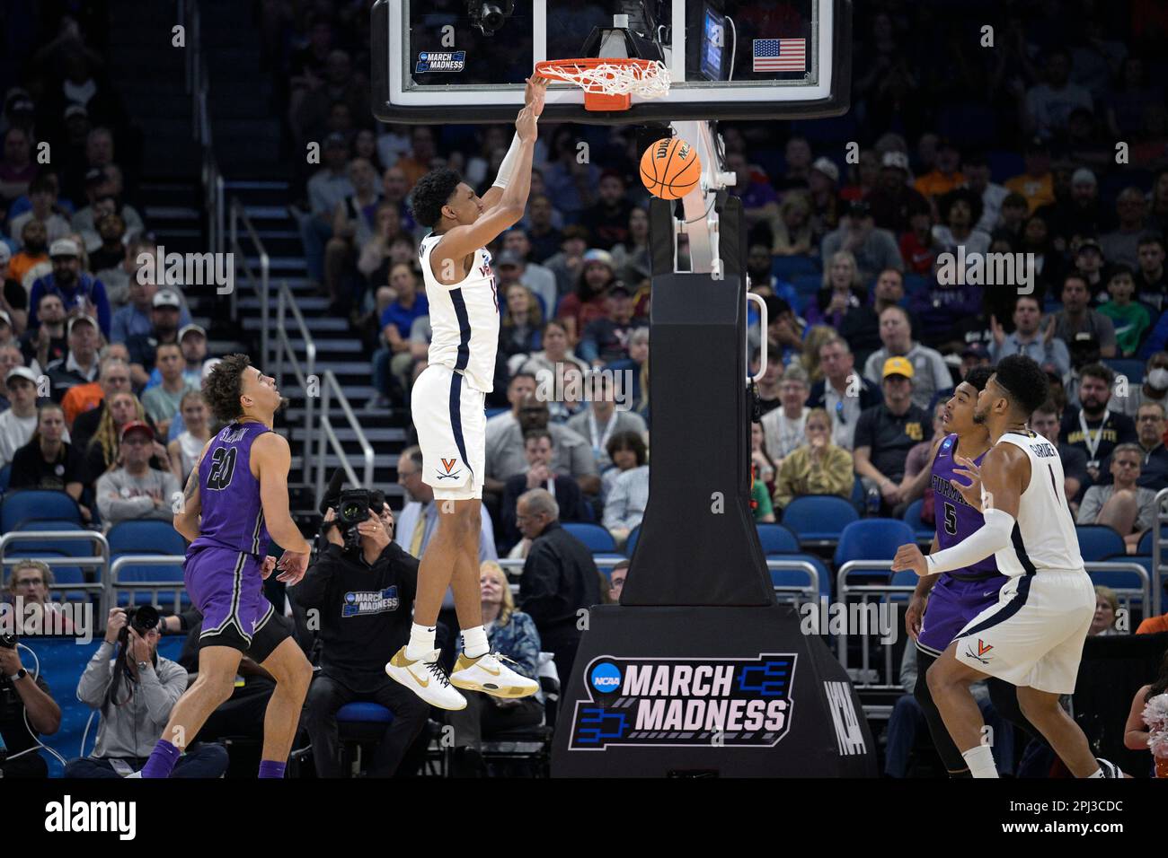 Virginia guard Ryan Dunn (13) dunks in front of Furman forward Jalen ...