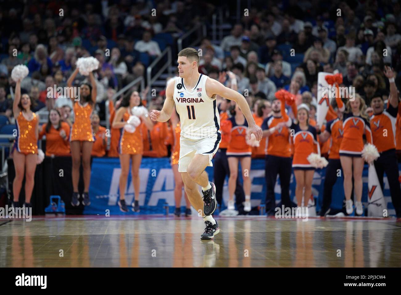 Virginia guard Isaac McKneely (11) runs up the court after scoring ...