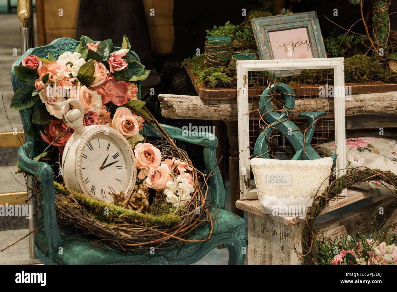 Wedding decoration with old clock and flowers. Vintage style Stock ...