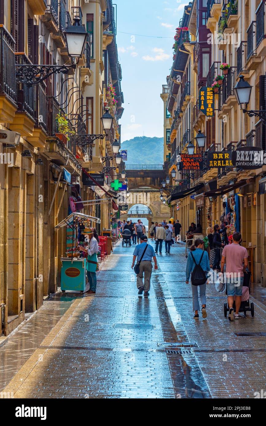 San Sebastian, Spain, June 2, 2022: People are strolling through a narrow street of the old town ...