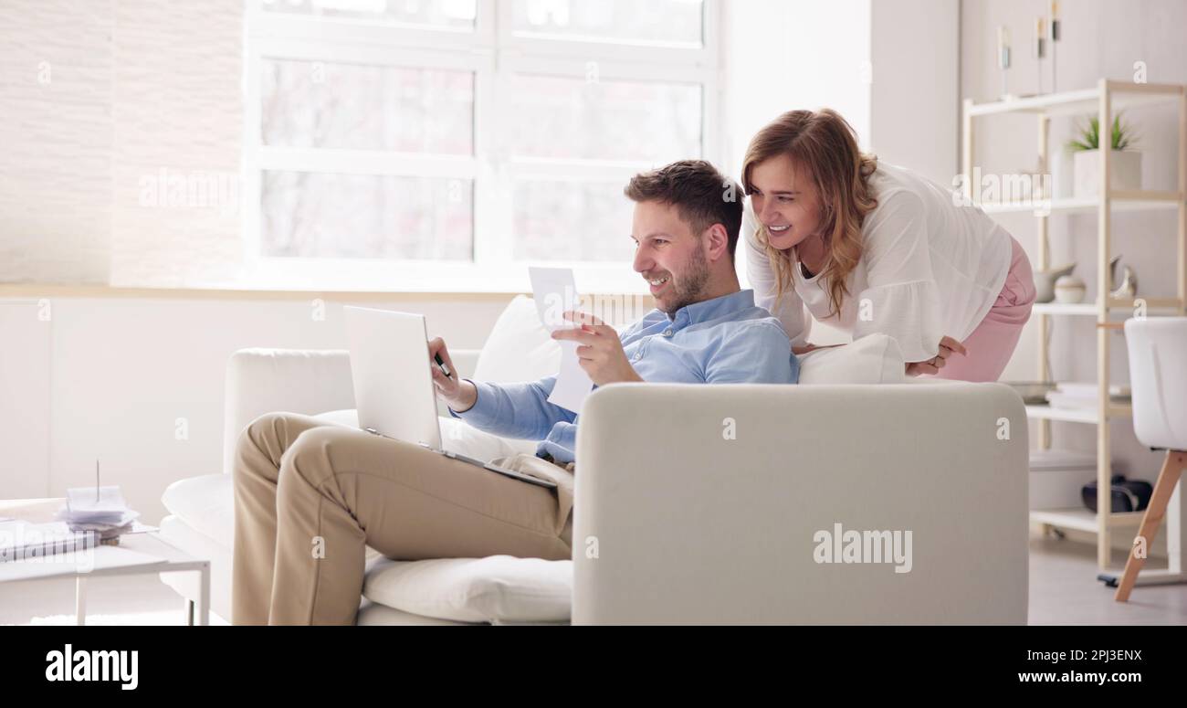 Portrait Of Couple Doing Home Finance With Calculator Stock Photo - Alamy