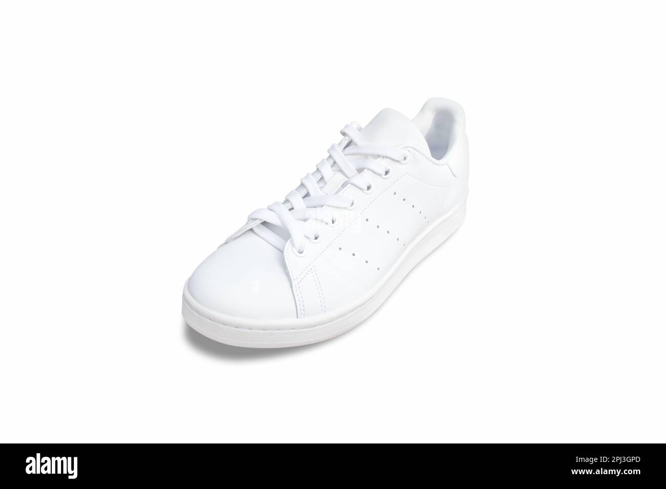 A white shoe isolated on white background Stock Photo - Alamy