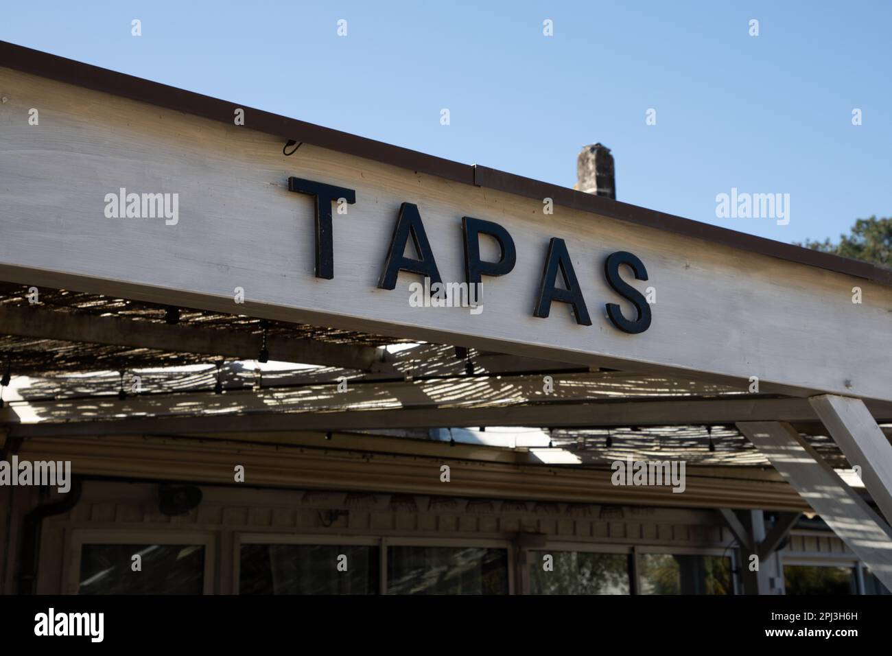 tapas text signboard on facade restaurant sign Stock Photo - Alamy