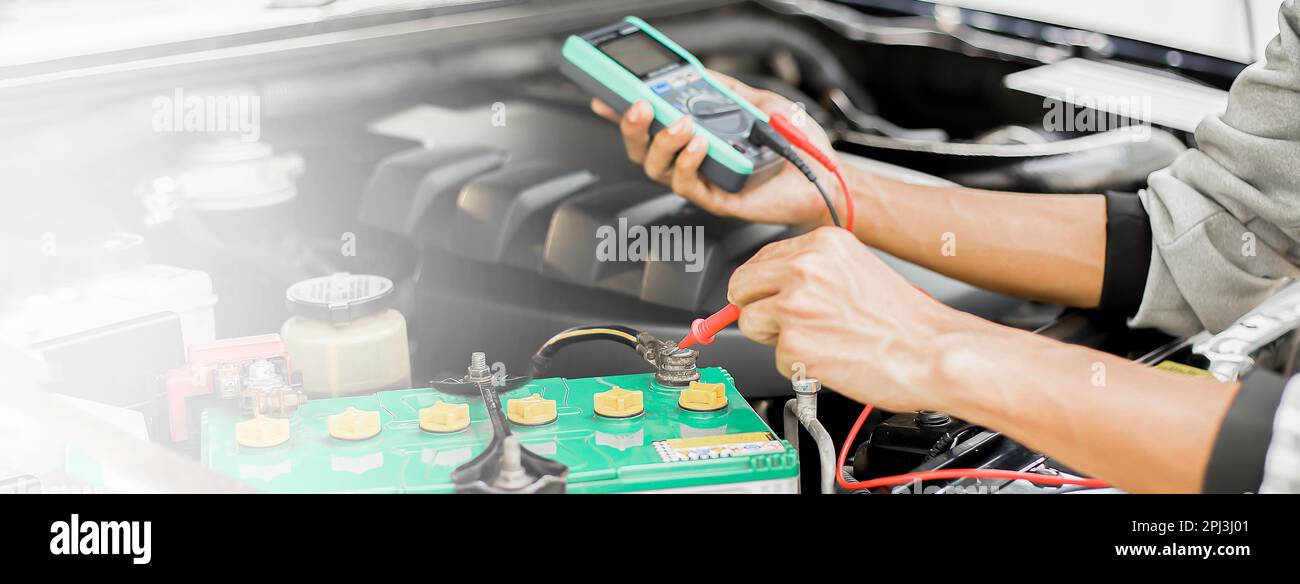 Mechanic checking car battery repairman hi-res stock photography and ...