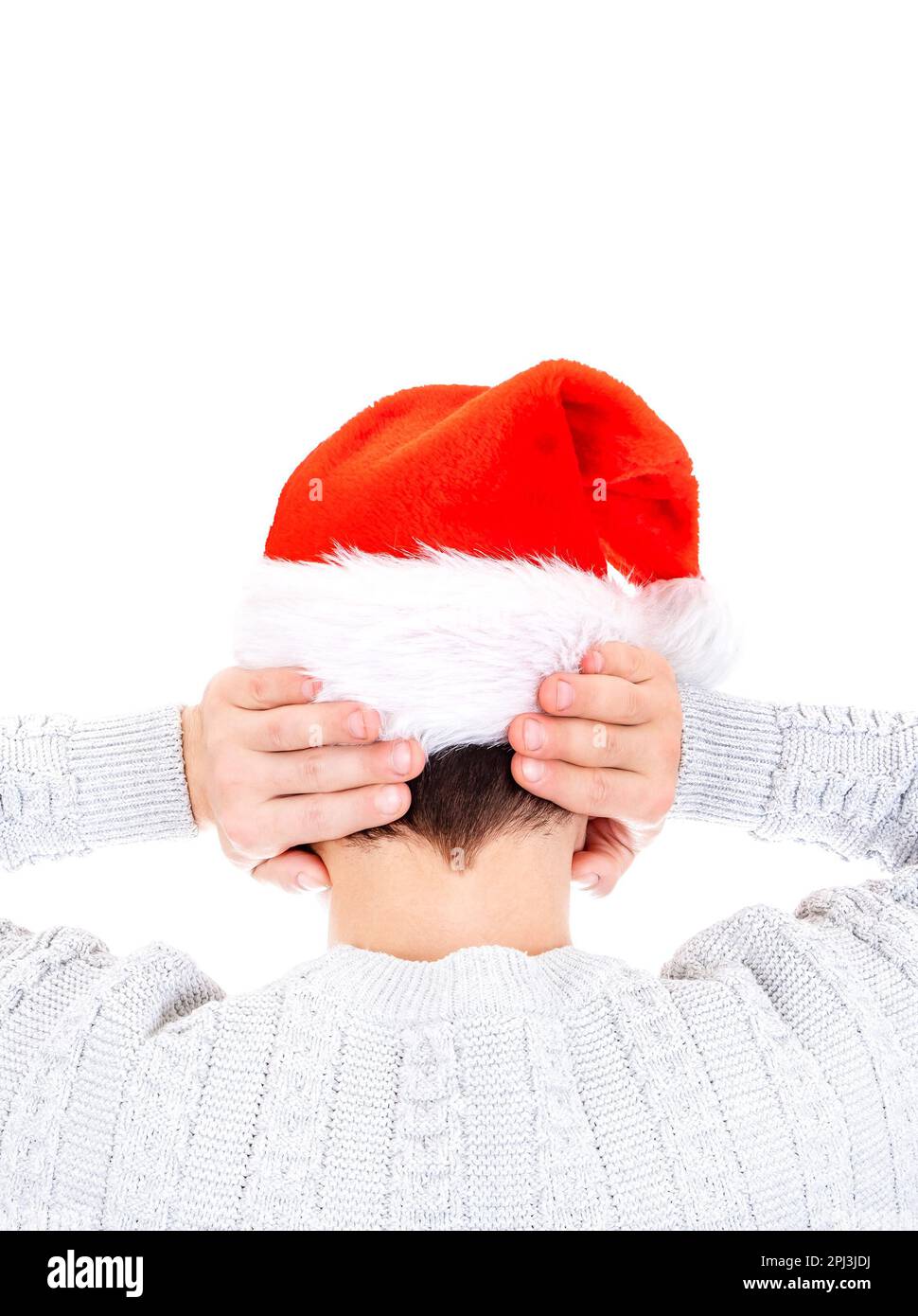 Rear View of Man in Santa Hat Covering his Ears on the White Background ...