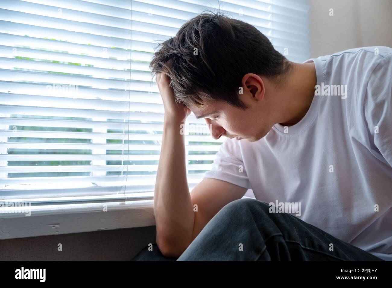 Teen sad window hi-res stock photography and images - Alamy