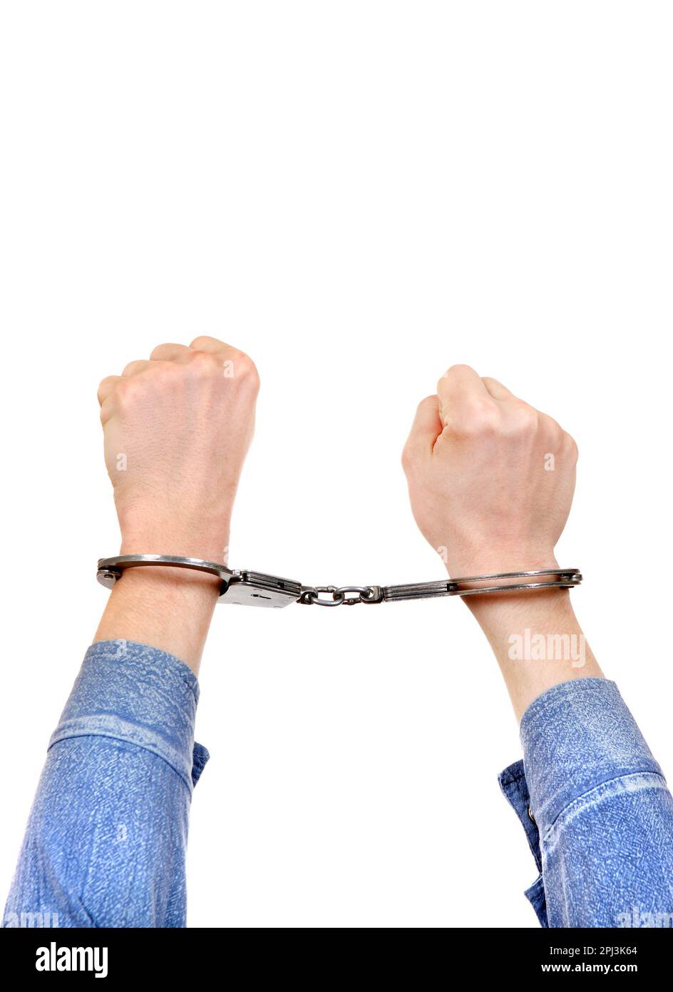 Handcuffs on hands hi-res stock photography and images - Alamy