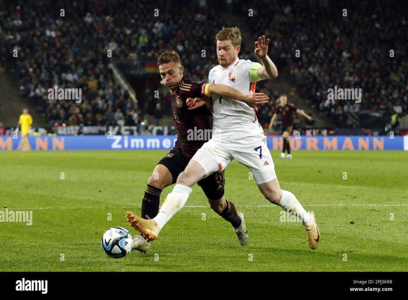 COLOGNE - (lr) Joshua Kimmich of Germany, Kevin De Bruyne of Belgium ...