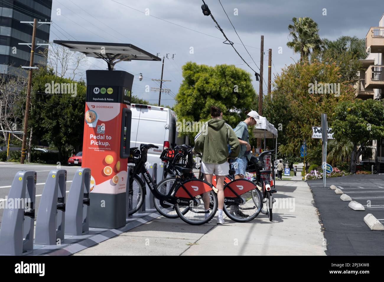 Los Angeles, California, USA. 30th Mar, 2023. Commuter cyclists grab a ...