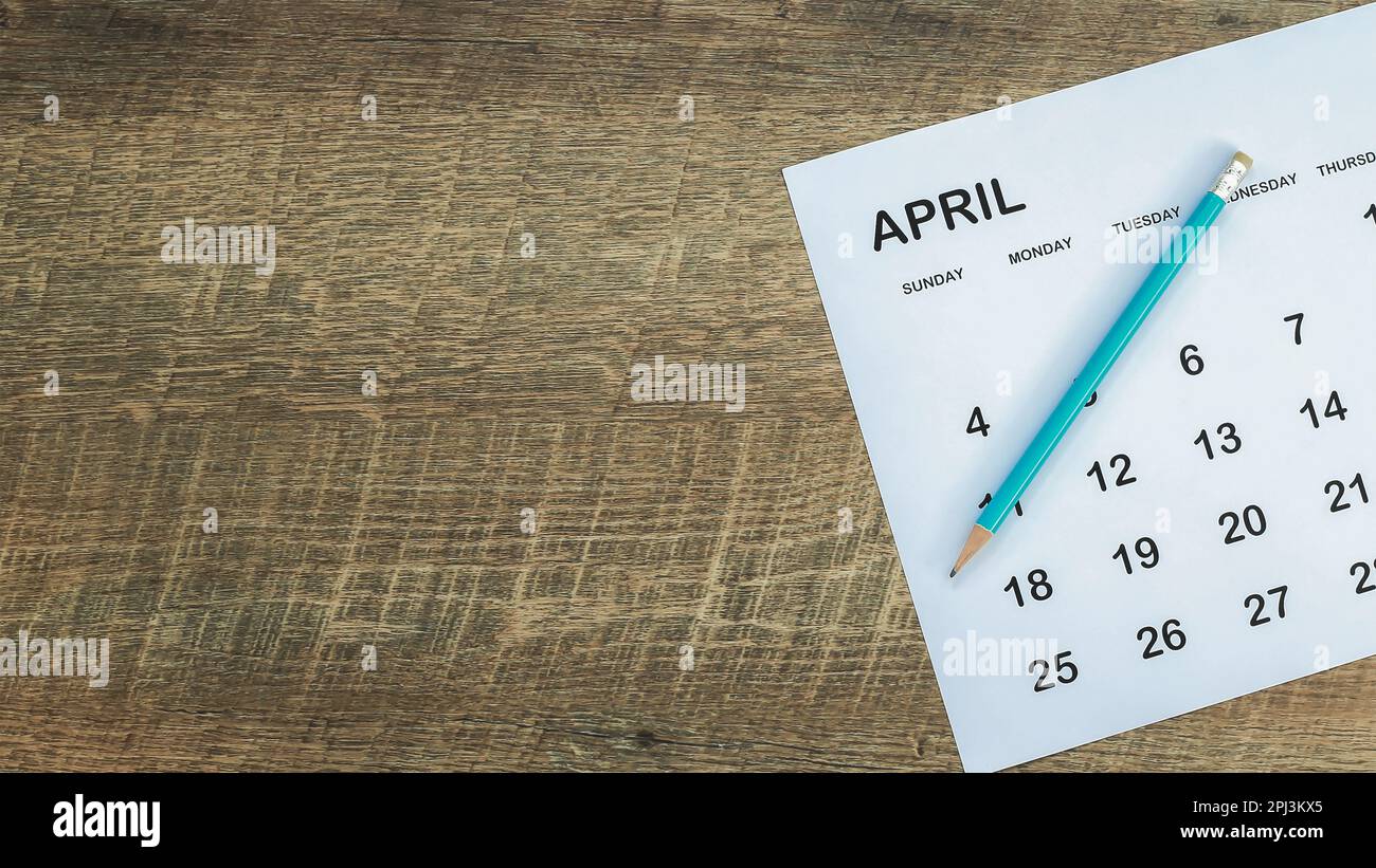white calendar on brown background Stock Photo - Alamy