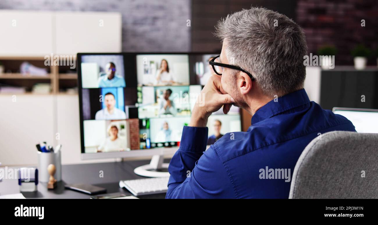 Bored Employee In Video Conference Training Meeting Stock Photo - Alamy