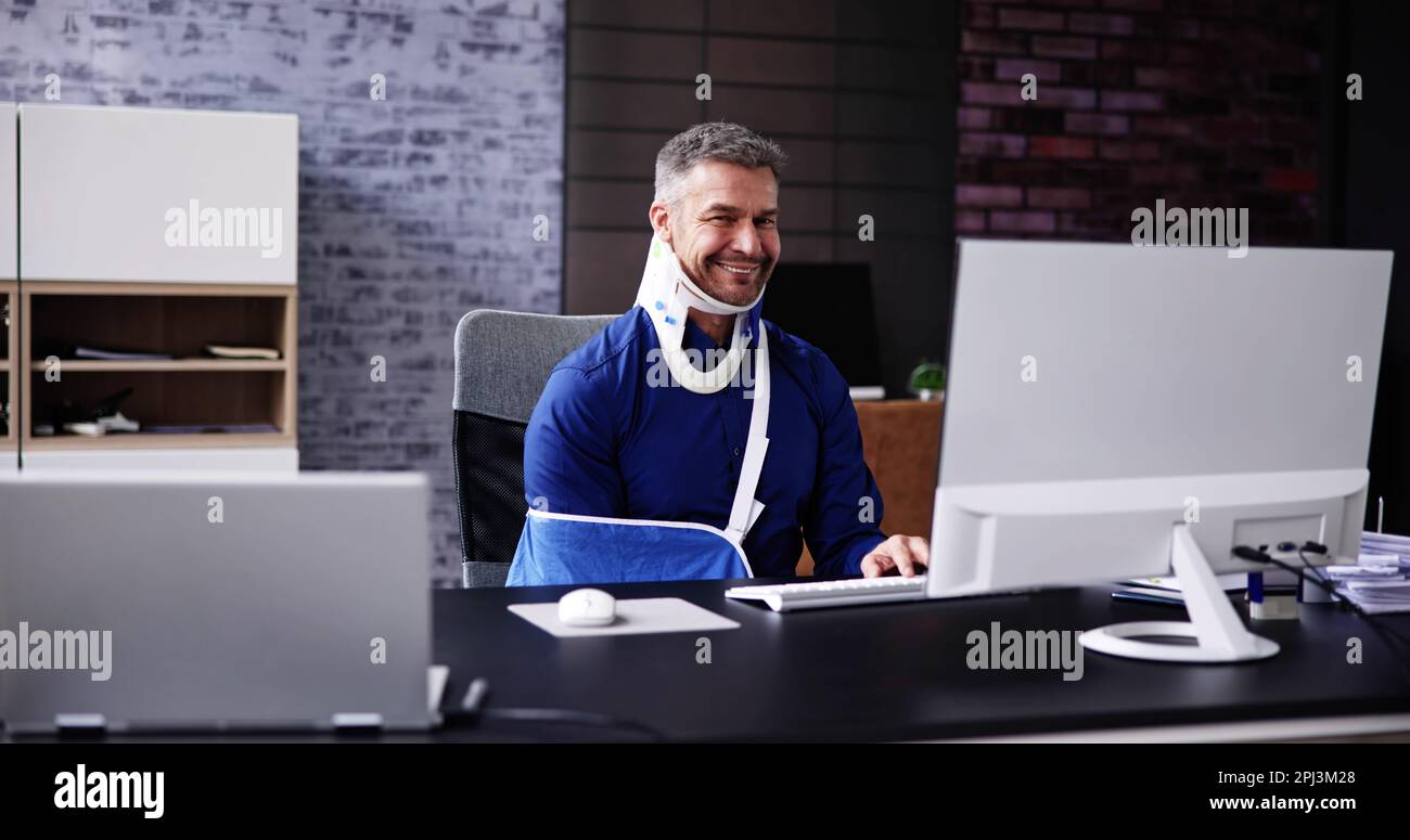 Broken Arm Injury Accident. Man In Office Using Computer Stock Photo ...