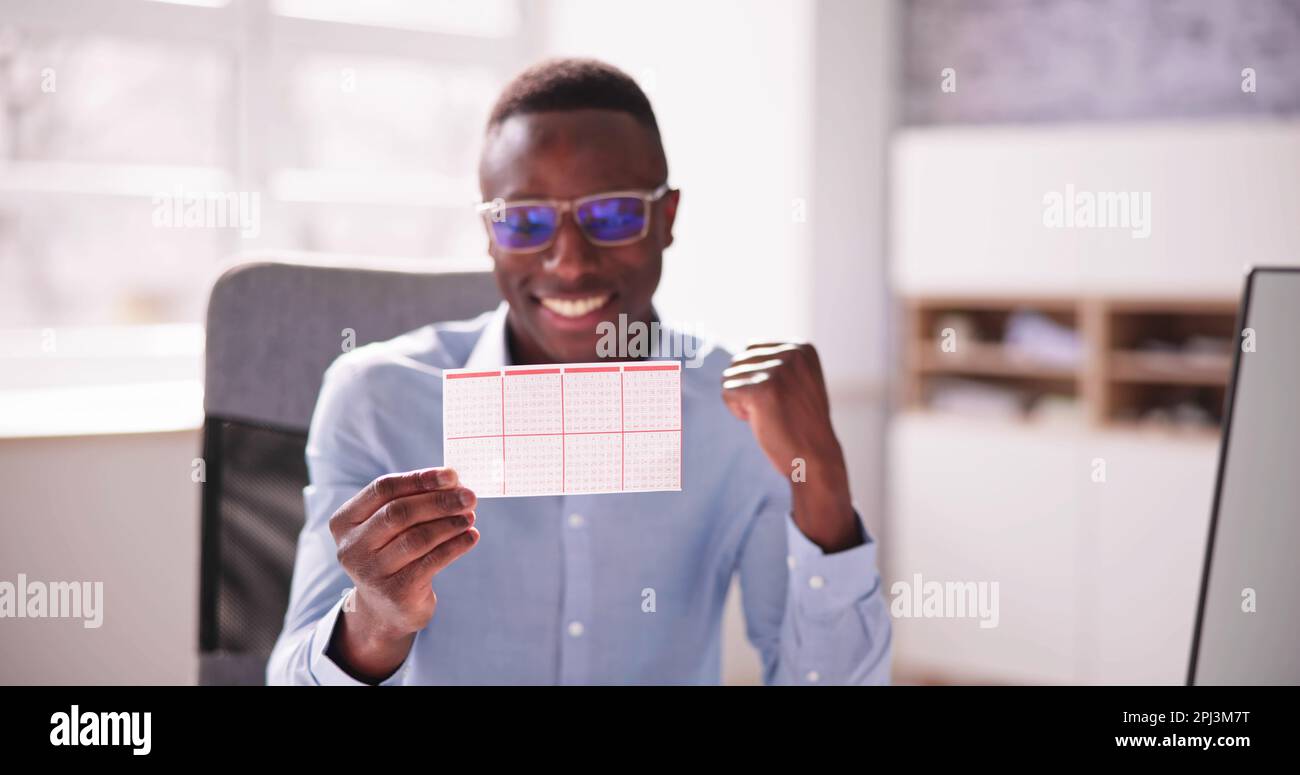 African Lottery Winner Person With Lotto Ticket Stock Photo - Alamy