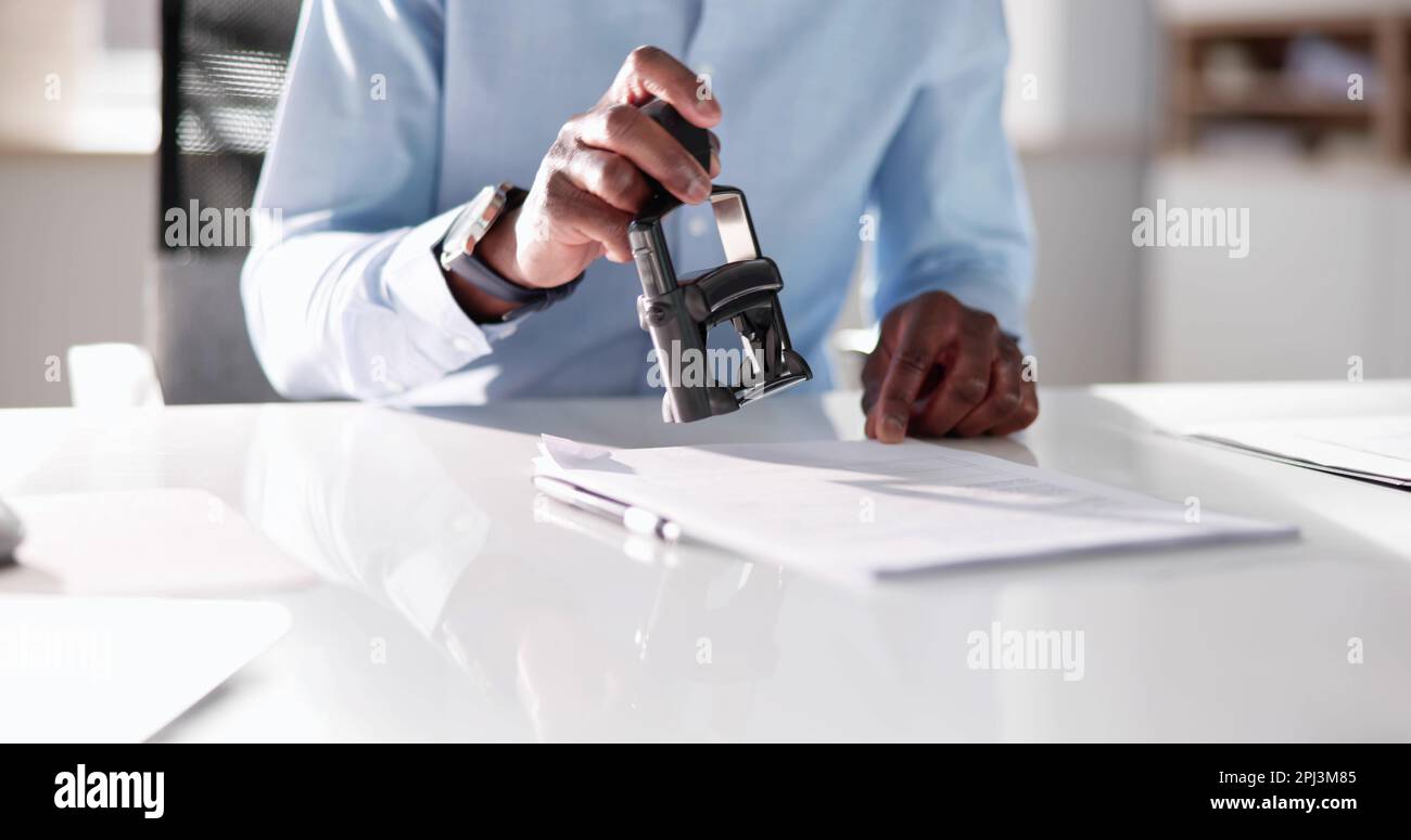 Approved Notary Stamp Rubber Stamp. Hand Pressing One Stock Photo - Alamy