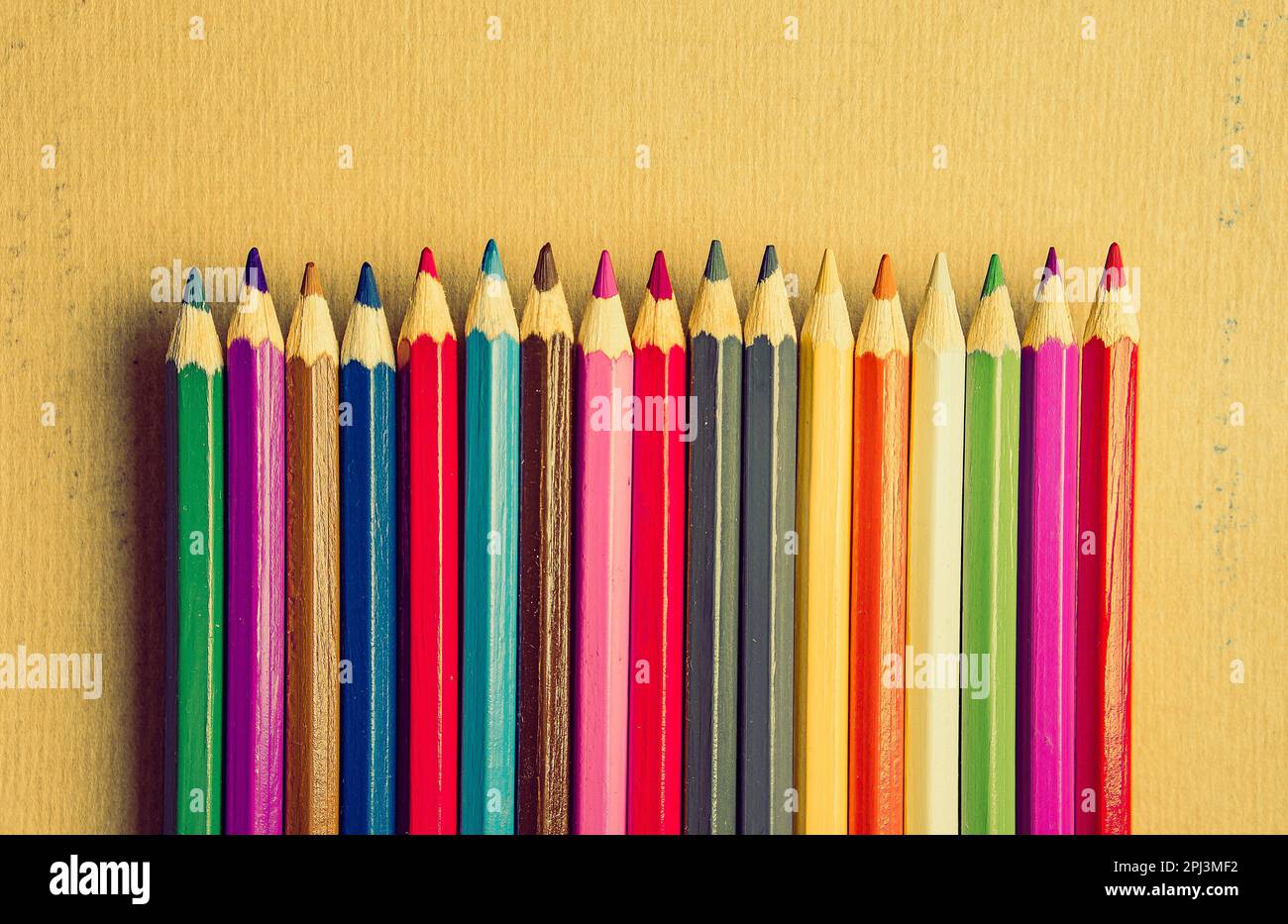 Color Pencils detail on the Old Paper Background closeup Stock Photo ...
